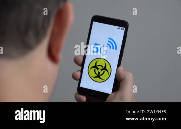 5g network danger concept. Man putting a smartphone to his ear. Back ...