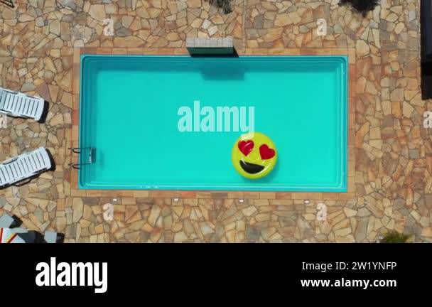 Mococa, Sao Paulo, Brazil. Smile emoji pool float scene at swimming ...
