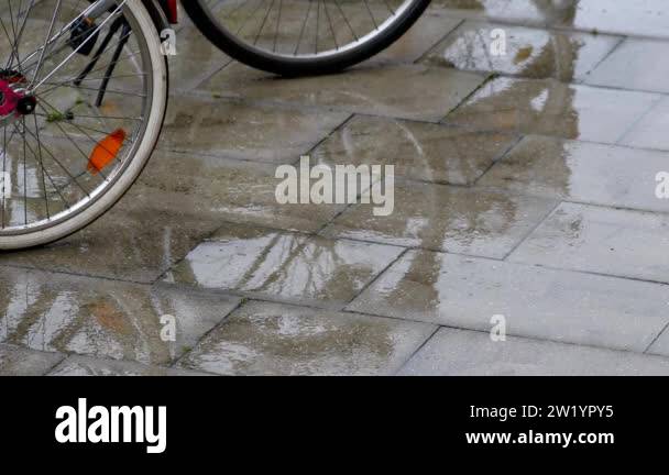 Falling rain with raindrops on bikes on a rainy day in fall and autumn ...