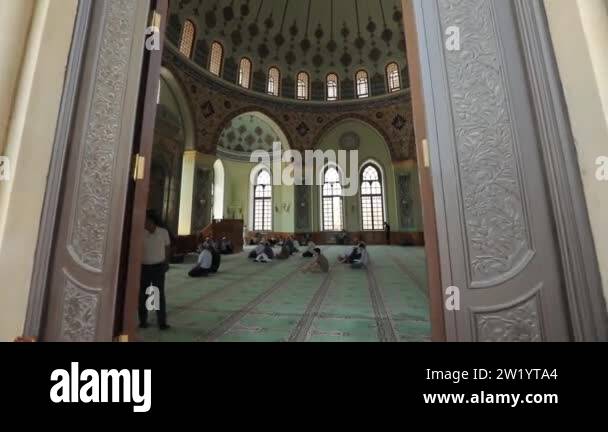 Baku, Azerbaijan - 2019. Muslims pray in a huge beautiful mosque. Men ...