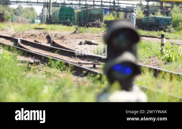 4k footage of camera focusing from long cargo trains on railroad to ...
