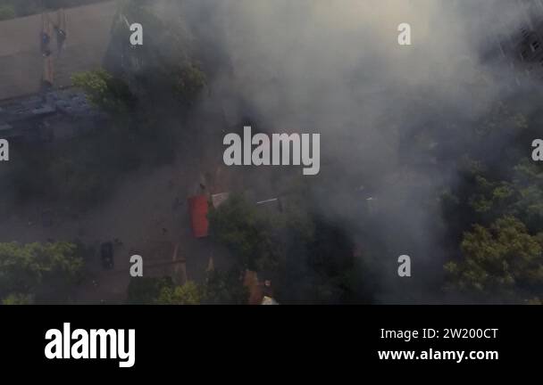 fire industrial building and fog smoke fireman shooting from a height ...