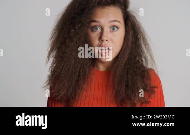 Emotional scared brunette girl stare with bugged eyes standing alarmed ...