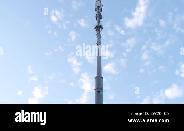5G network tower on a blue sky background. cell phone tower 2G 3G 4G 5G ...
