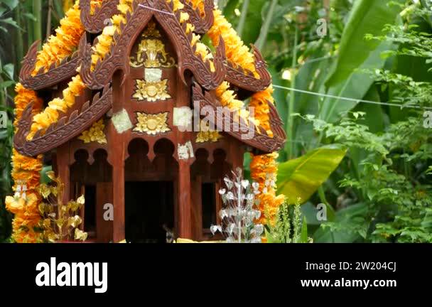 Wooden miniature guardian spirit house. Small buddhist temple shrine ...