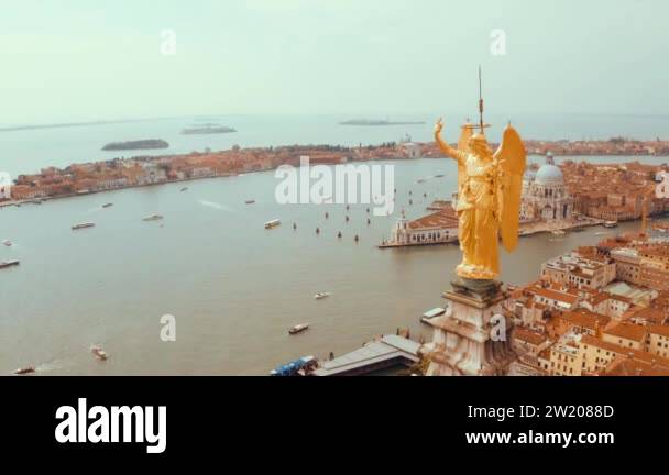 golden statue of angel on top of clock tower in st marks square Stock ...