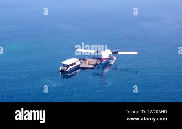 Sunny sky of marine island beach break by aqua blue lagoon with bright ...