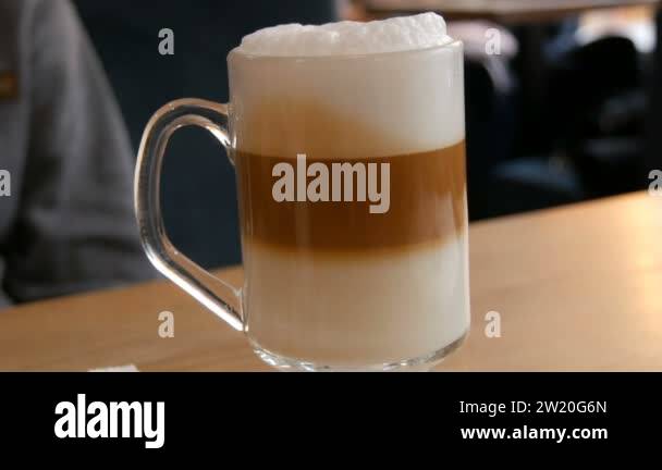 Delicious freshly made latte on a table in a cafe. Latte coffee milk ...