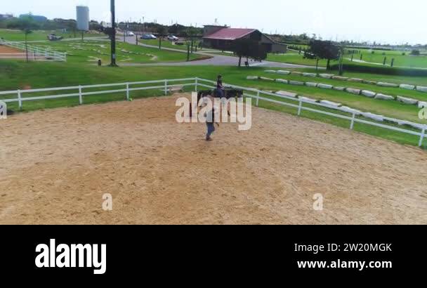 Children kids learning a lesson riding a horse at farmland ranch ...