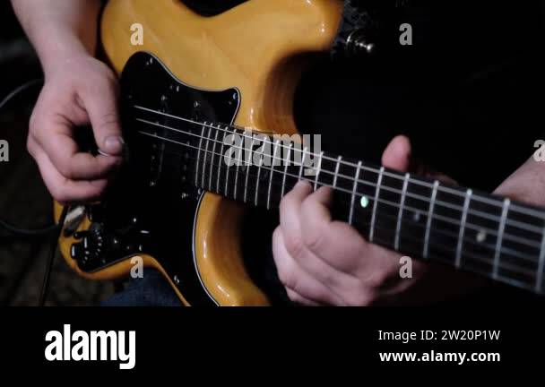 Man lead guitarist playing electrical guitar on concert in a club Stock ...