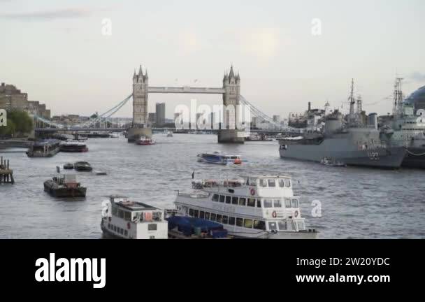 Ships in river on background of old architectural bridge with towers ...
