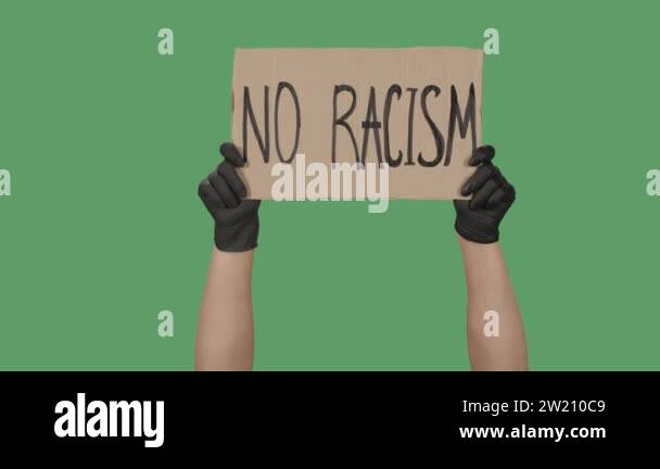 NO RACISM. Protest text message on cardboard. Stop racism. Police ...