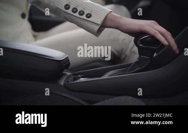 Close-up of female Caucasian hand holding gear shift. Unrecognizable ...