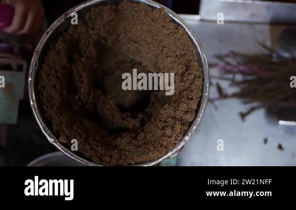 Automatic incense stick making machine. Vietnamese woman working in the ...