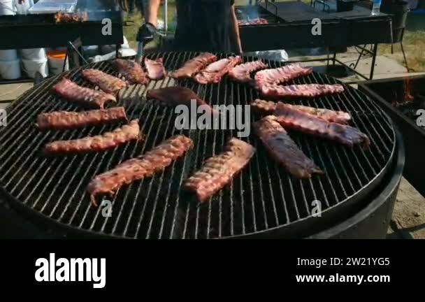 Large electric rotating grill for cooking ribs. The ribs rotate and are ...