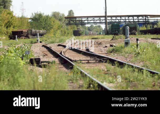 4k dolly video of railroad station with long cargo train cars. Concept ...