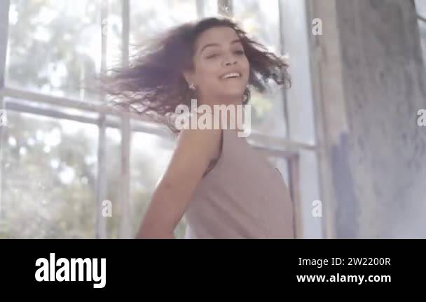 Woman with long hair dancing modern dance. Contemporary freestyle ...