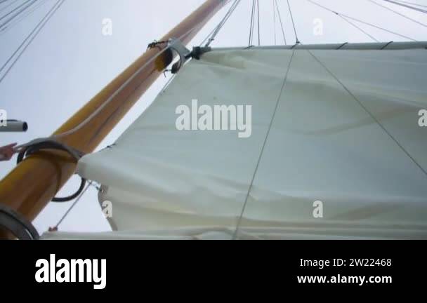 sail being hoisted on wooden ship historic Stock Video Footage - Alamy