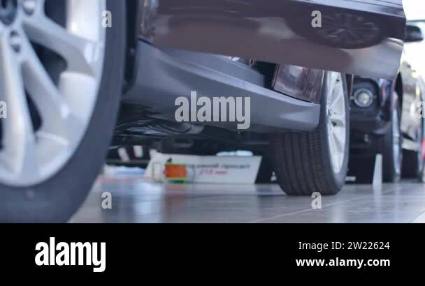Close-up of young female Caucasian feet in jeans and black high-heel ...