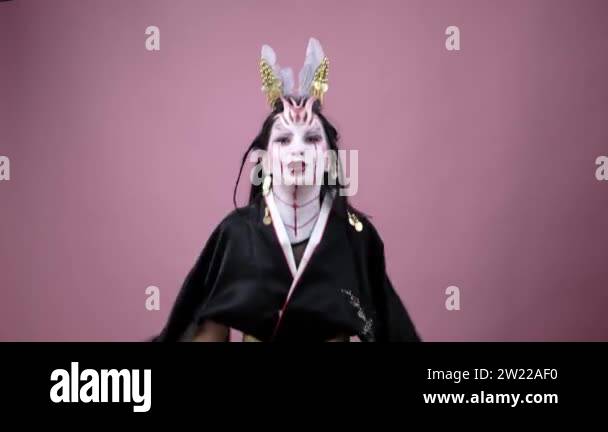 scary fantastic Chinese woman with blood from the mouth and white face ...