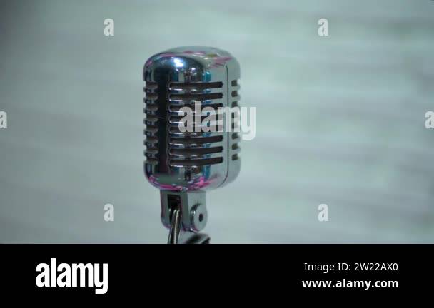 Professional concert silver vintage glare microphone in the center of ...