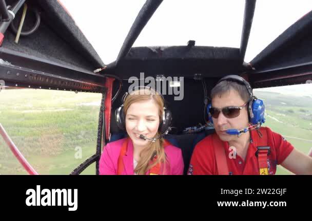 The pilot and passenger, small aircraft. Panoramic flight. The camera ...