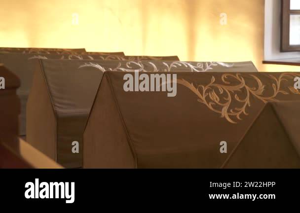 Cloth covered caskets in the place of worship. A coffin is a funerary ...