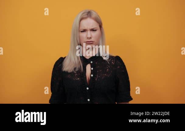 irritated woman shows negative attitude and an angry expression on face ...