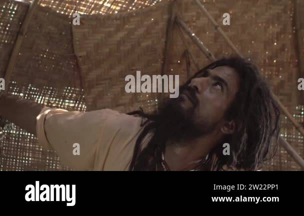 Shamanic session in the bungalow. Shaman during prayer during prayer ...