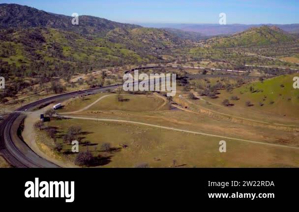 The video captures the Tehachapi Train Loop, an iconic railway loop ...