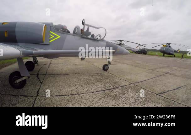 The assistant pilot close the cockpit. The crew of the gray fighter ...