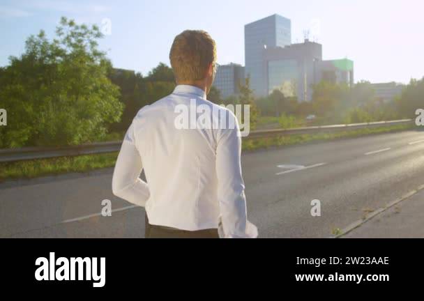 LENS FLARE: Unrecognizable man walking home after a successful day at ...