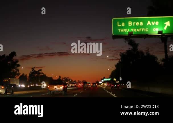 View from the car. Los Angeles busy freeway at night time. Massive ...