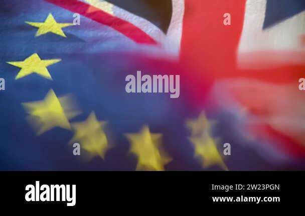 UK Union Jack and European Union EU flags reflected in rippling water ...