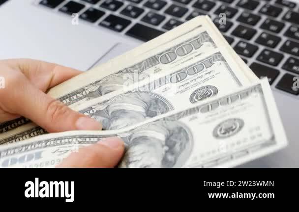 Woman counting dollar bills. Close up of female hands count money cash. Woman employee counts ...
