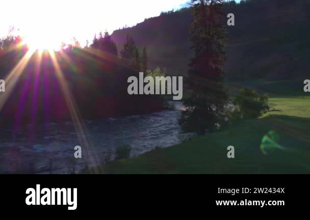 Forest landscape sun rays over the river cinematic shots, aerial ...