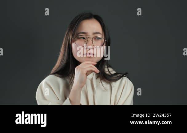 Portrait of young asian thinking pondering girl having idea moment ...