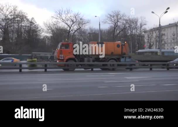 Moscow / Russia - January 18 2020: A sweeping machine moves along the ...