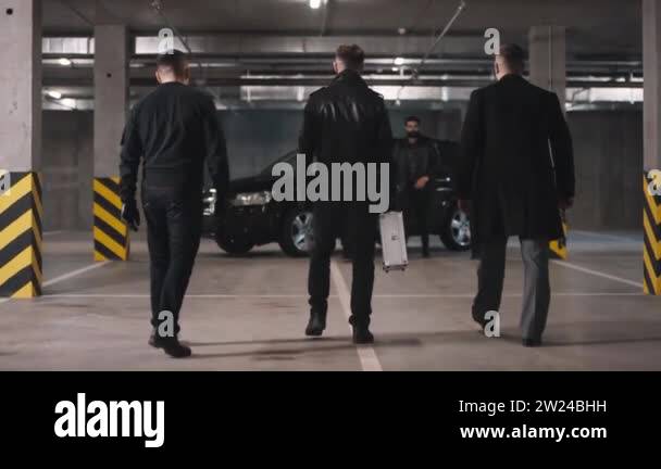 Back-view full shot of two assertive multi ethnic criminal gangs ...