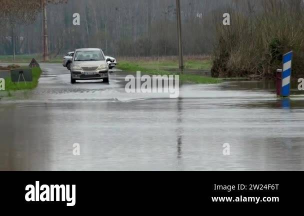 Water over road, Road flooded by overflow of a river and danger road ...