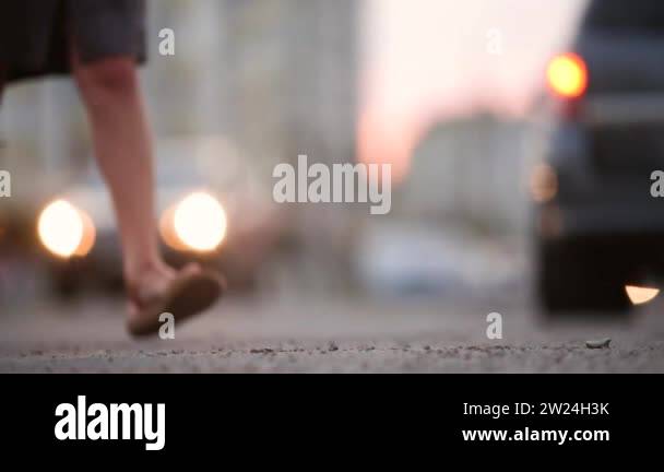 Woman driver putting an emergency stop sign behind broken blurred car ...