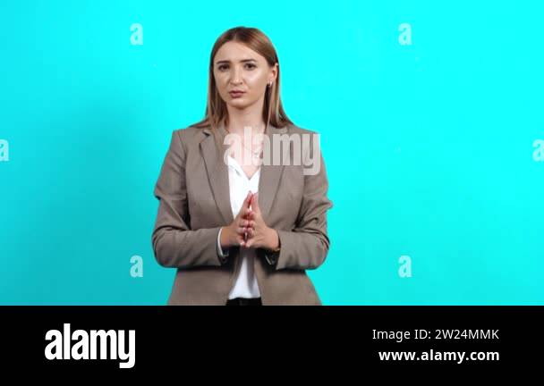 Aggressive, domineering, middle-aged woman who crosses her fingers ...