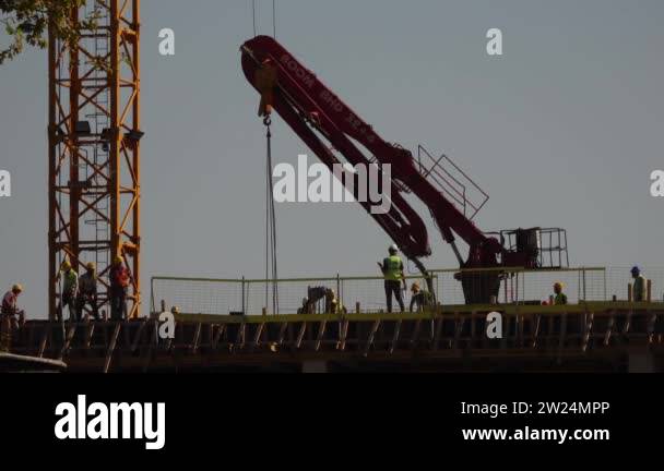 Construction workers at the top of building timelapse. construction ...