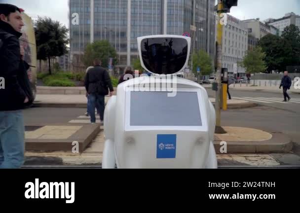 Milan, Italy - March 5, 2020: a robot walks through the city streets ...