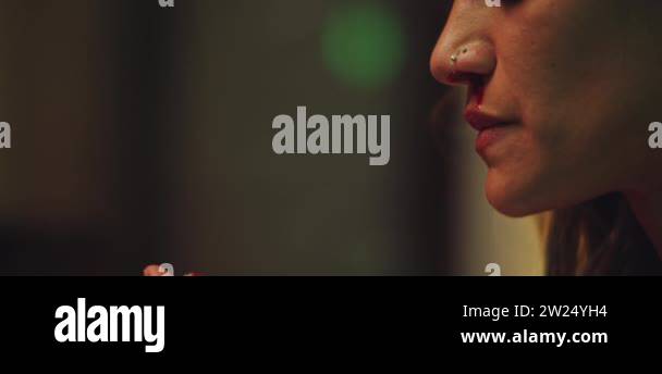 Young woman wiping her nose from nosebleed, feeling scared. Horror ...