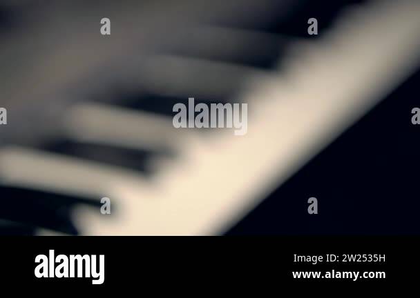 Synthesizer Keyboard. Fingers close on piano keys. Men's hands play ...