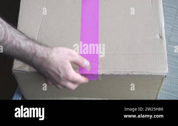 Pull to open strip box package man hand Stock Video Footage - Alamy