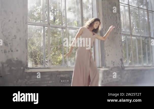 Woman with long hair dancing modern dance. Contemporary freestyle ...