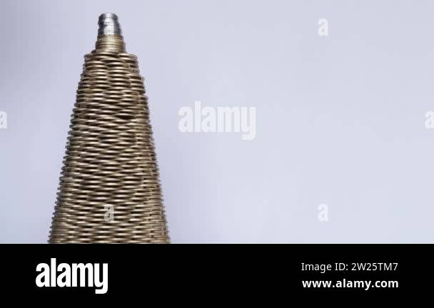 Rotating cone made of golden coins with white background Stock Video ...