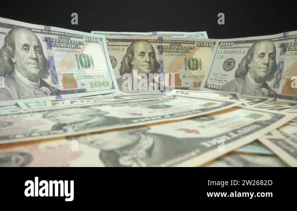 USD american bills on the table with black background. Low angle. Macro ...
